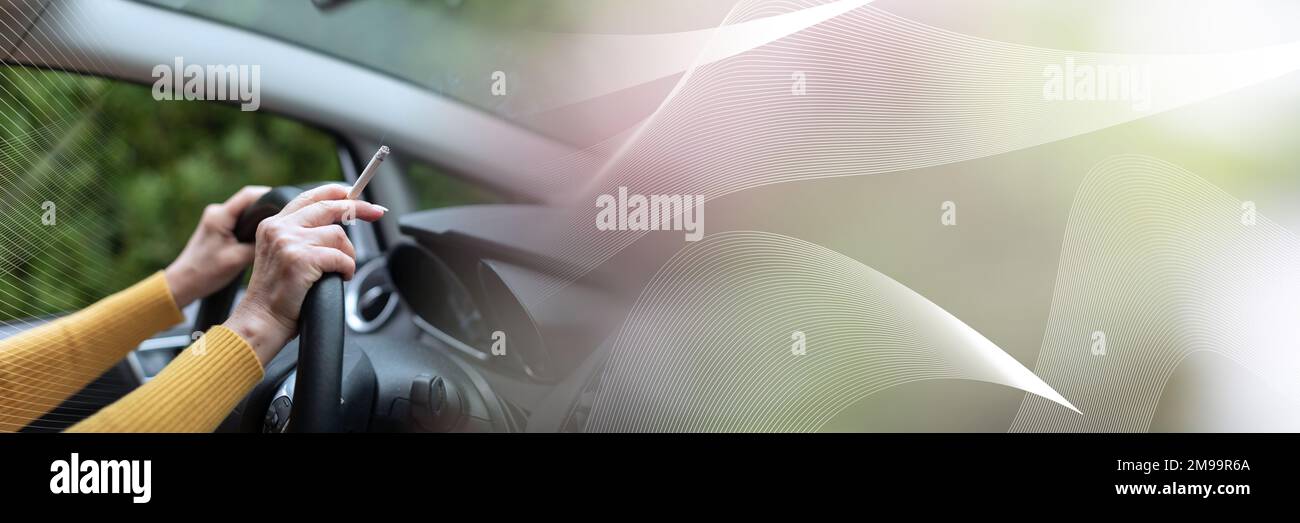 Woman smoking a cigarette while driving; panoramic banner Stock Photo ...