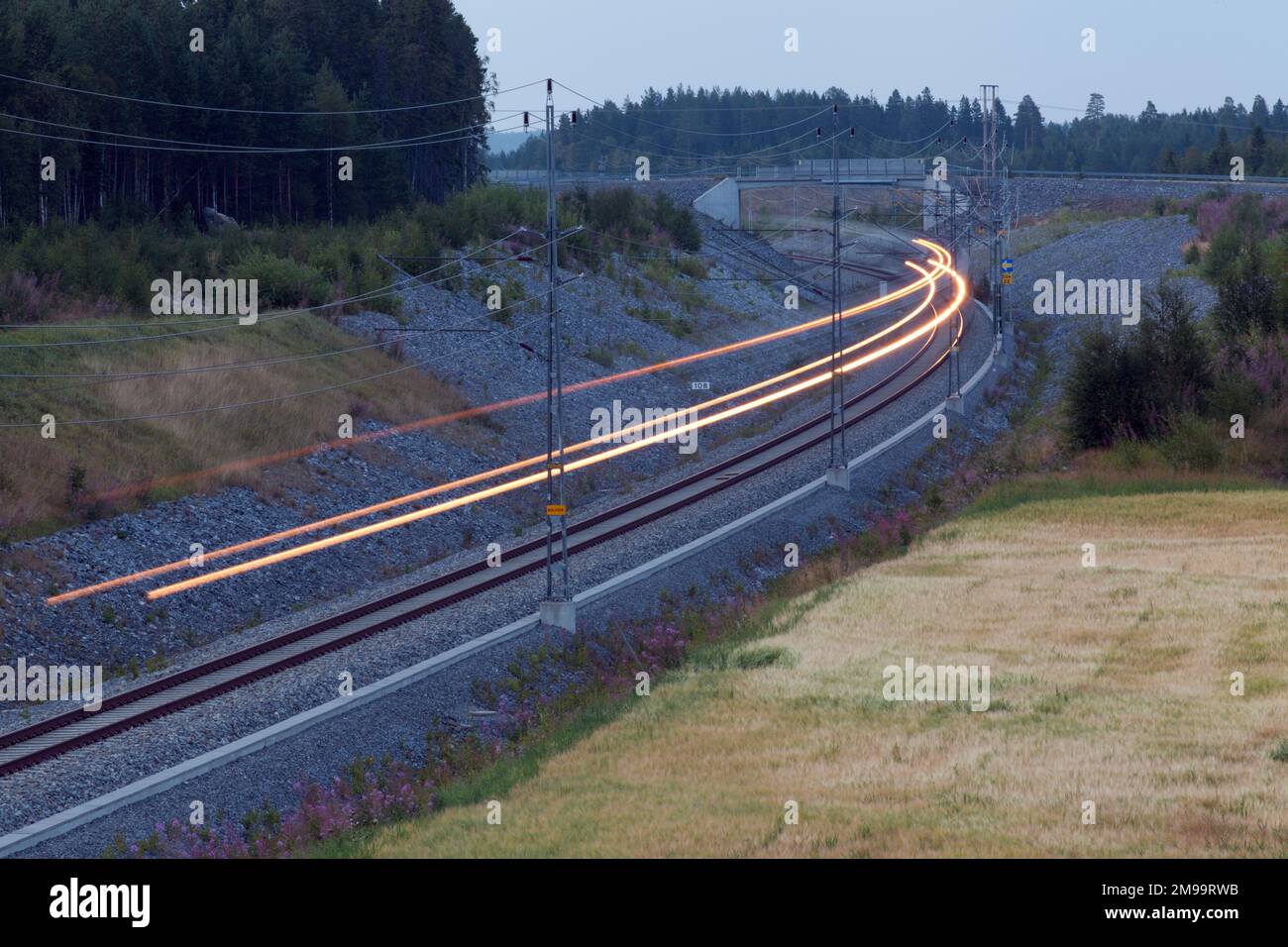 The invisible night train on an August evening through the landscape ...