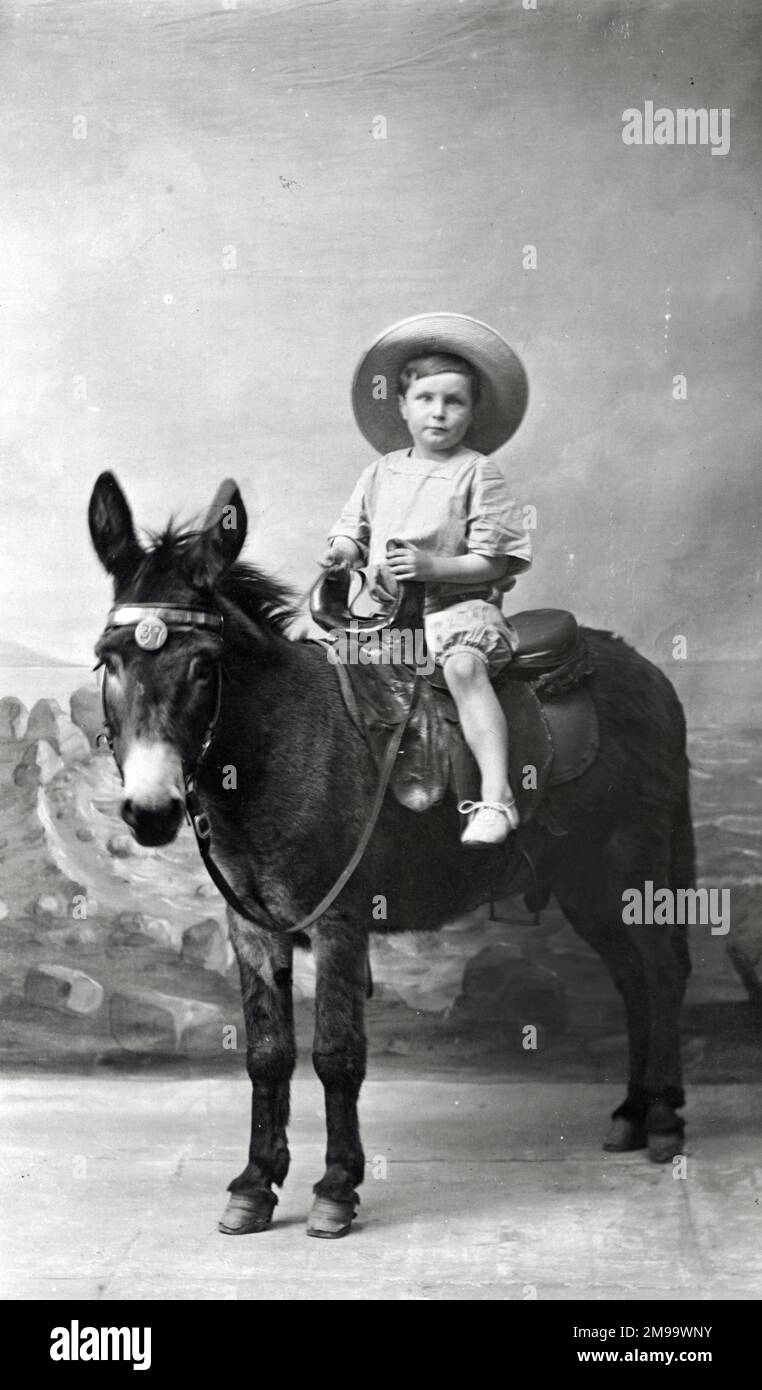 Young Boy in his summer beach attire and sunhat - Studio photo, with ...