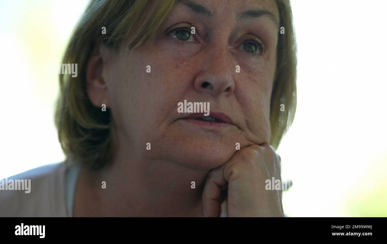 Pensive concerned older woman thinking. Senior lady pondering solution ...