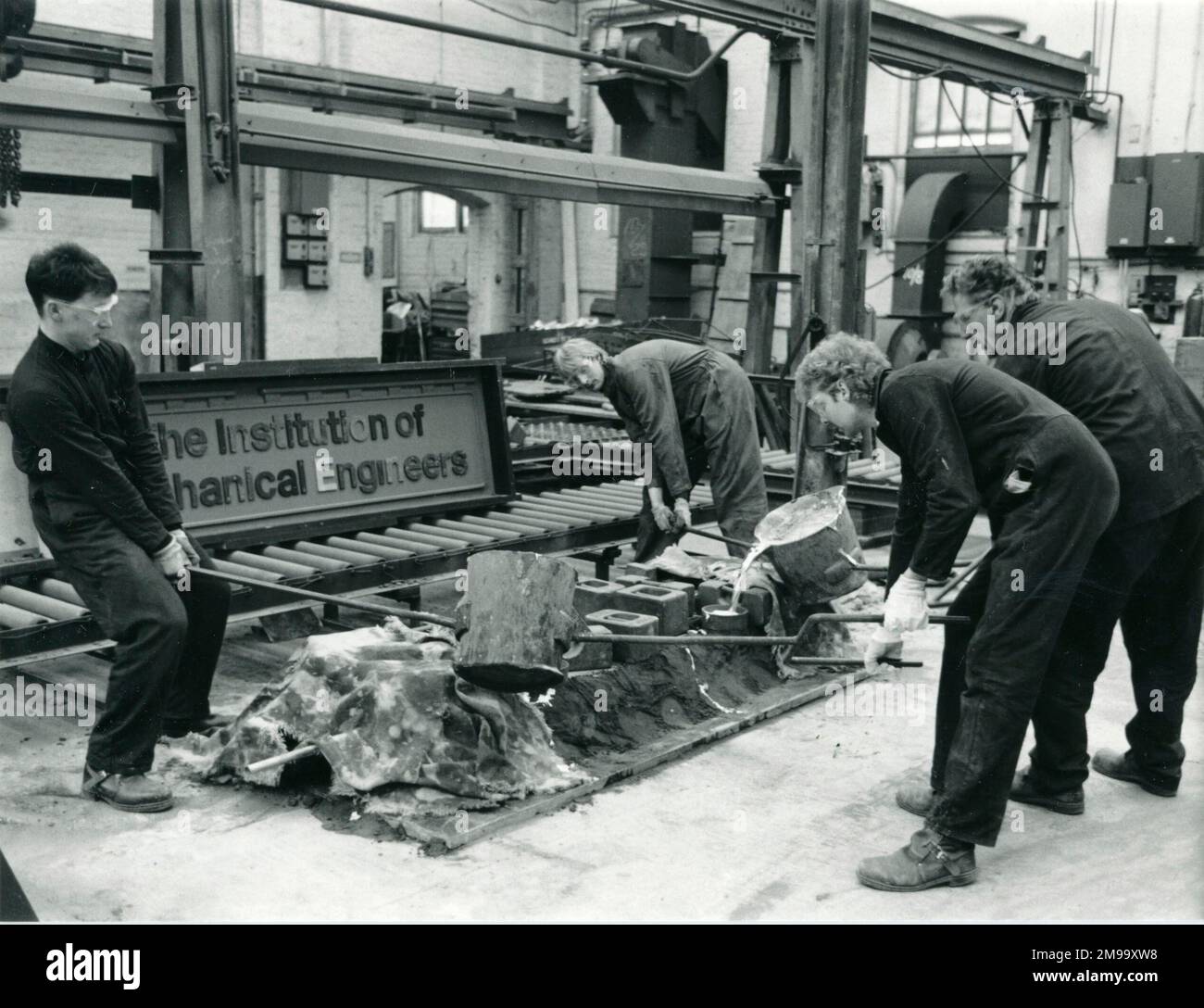 Photograph of the casting of a name plate for a locomotive named 'The ...