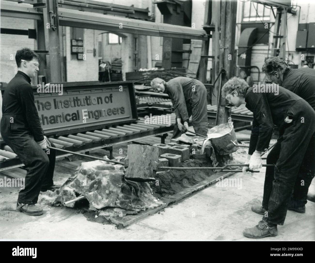Photograph of the casting of a name plate for a locomotive named 'The ...