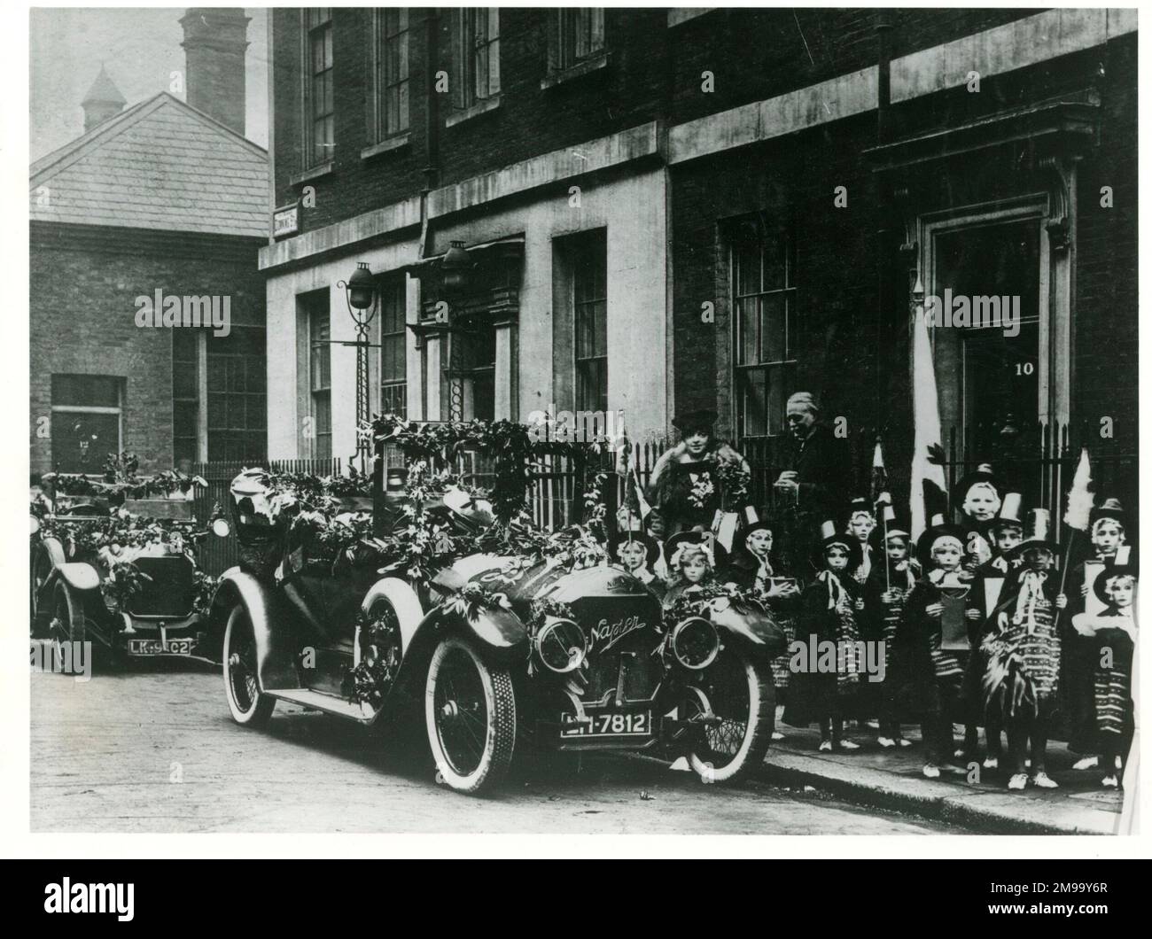 Two garlanded Napier's carrying Welsh schoolchildren in national dress ...