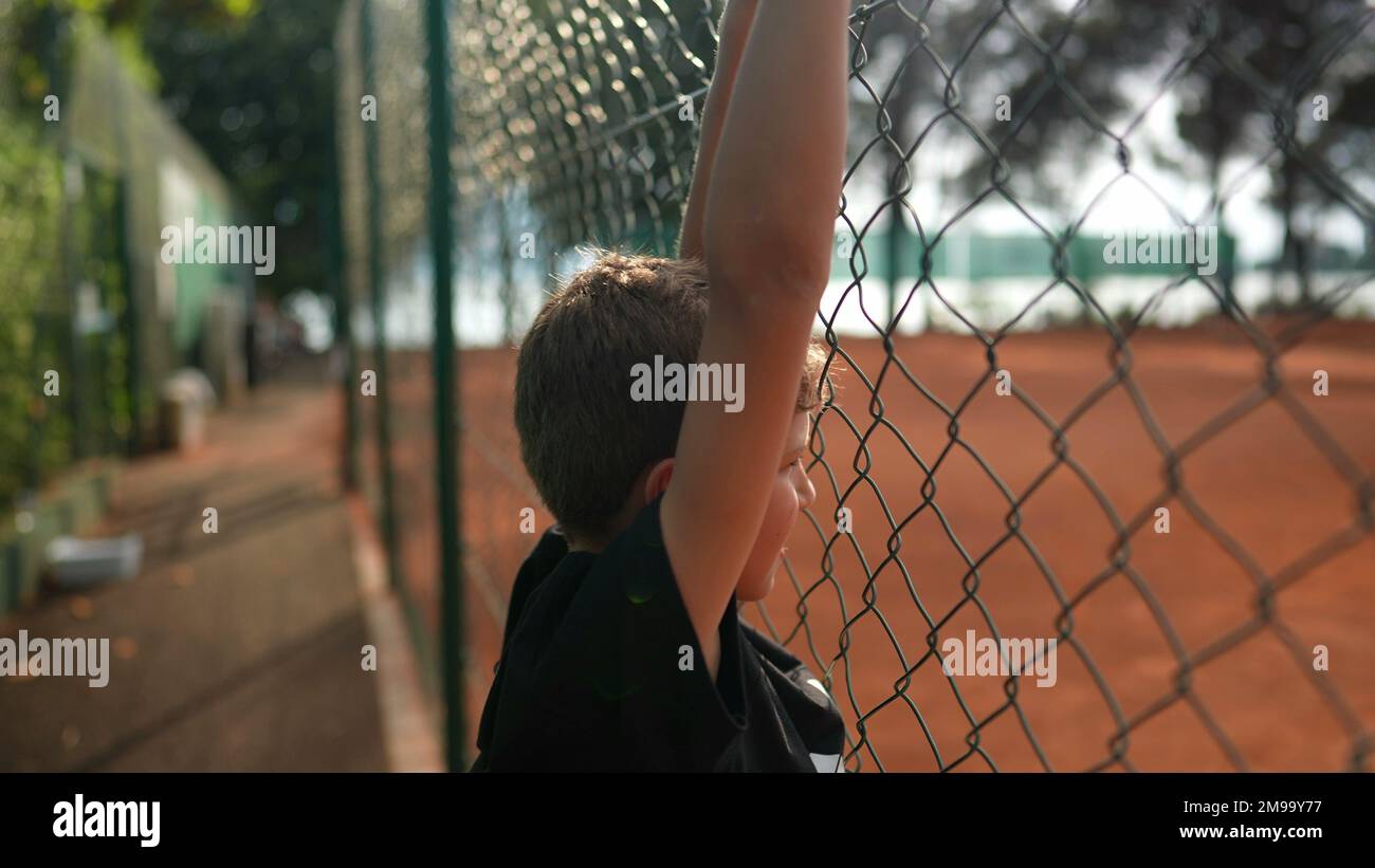 Little boy watching tennis match clapping hands observing sport game ...