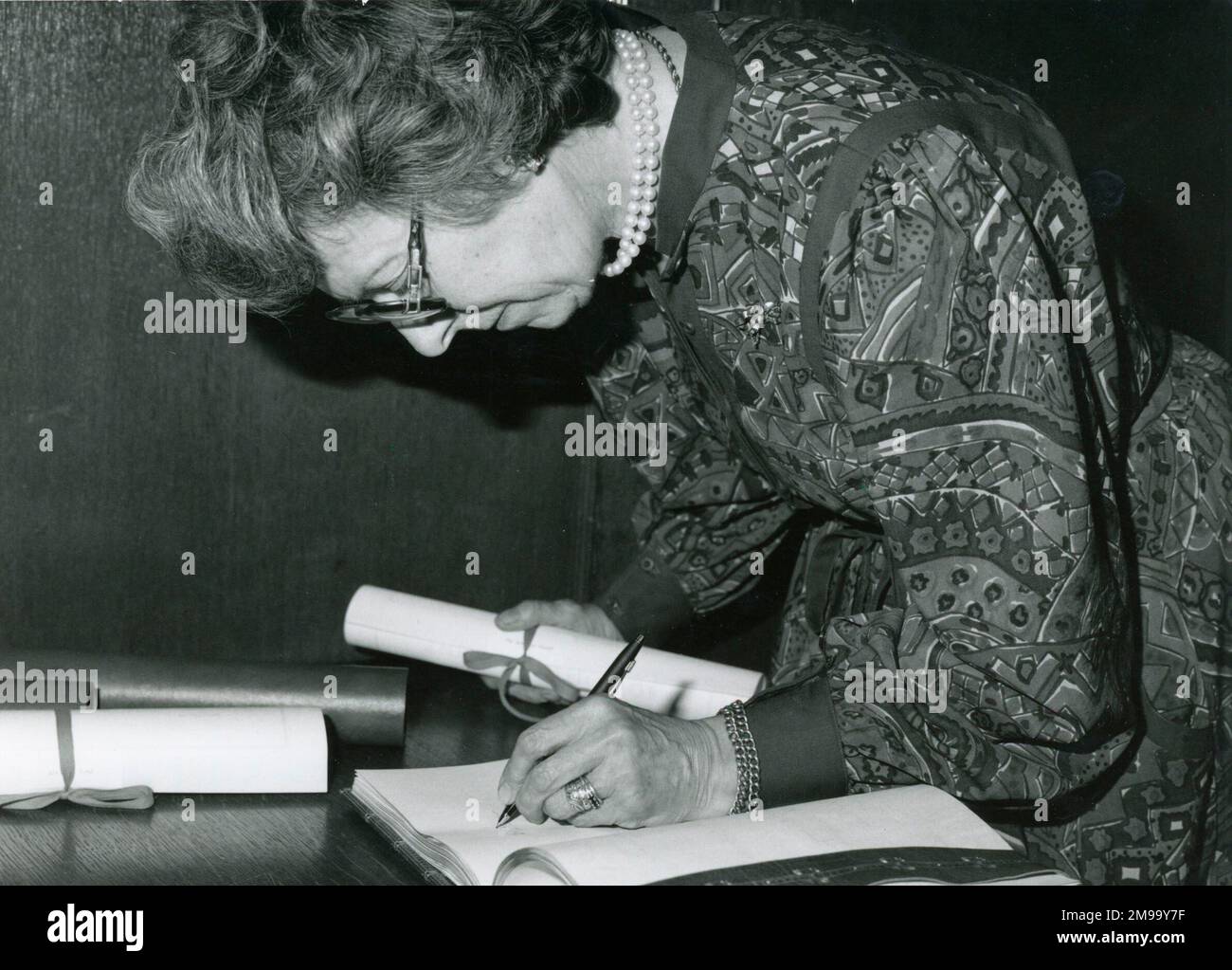 Portrait of Baroness Beryl Platt, Baroness Platt of Writtle signing ...