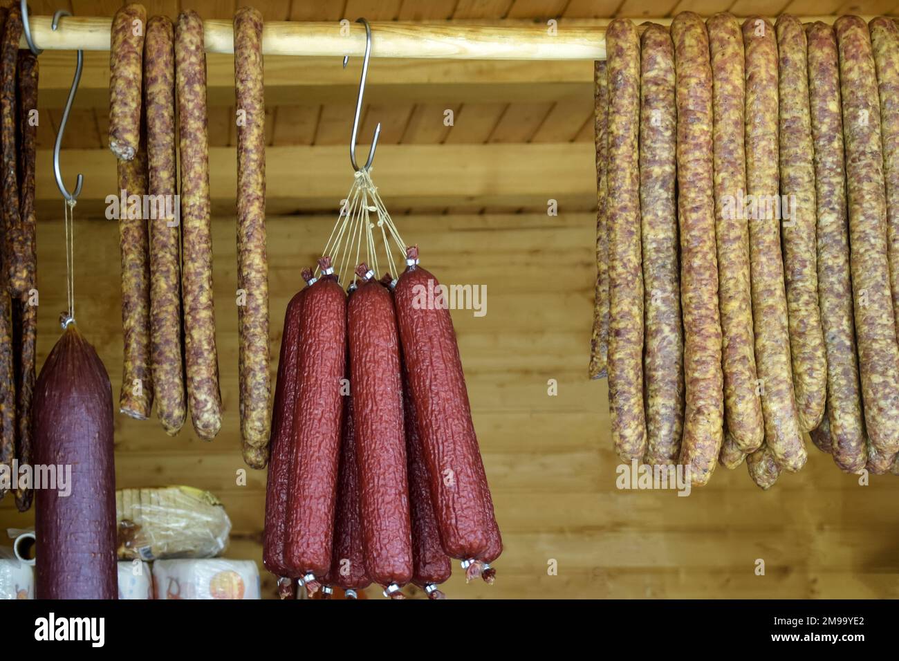 Sausage and others meat smoked delicacies of different colors and sizes ...