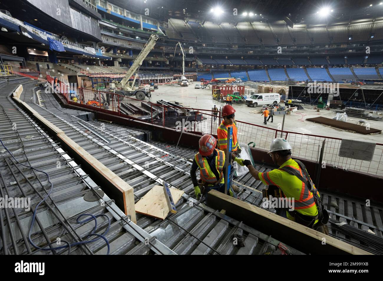 Workers build concrete forms during the Rogers Centre renovation in ...