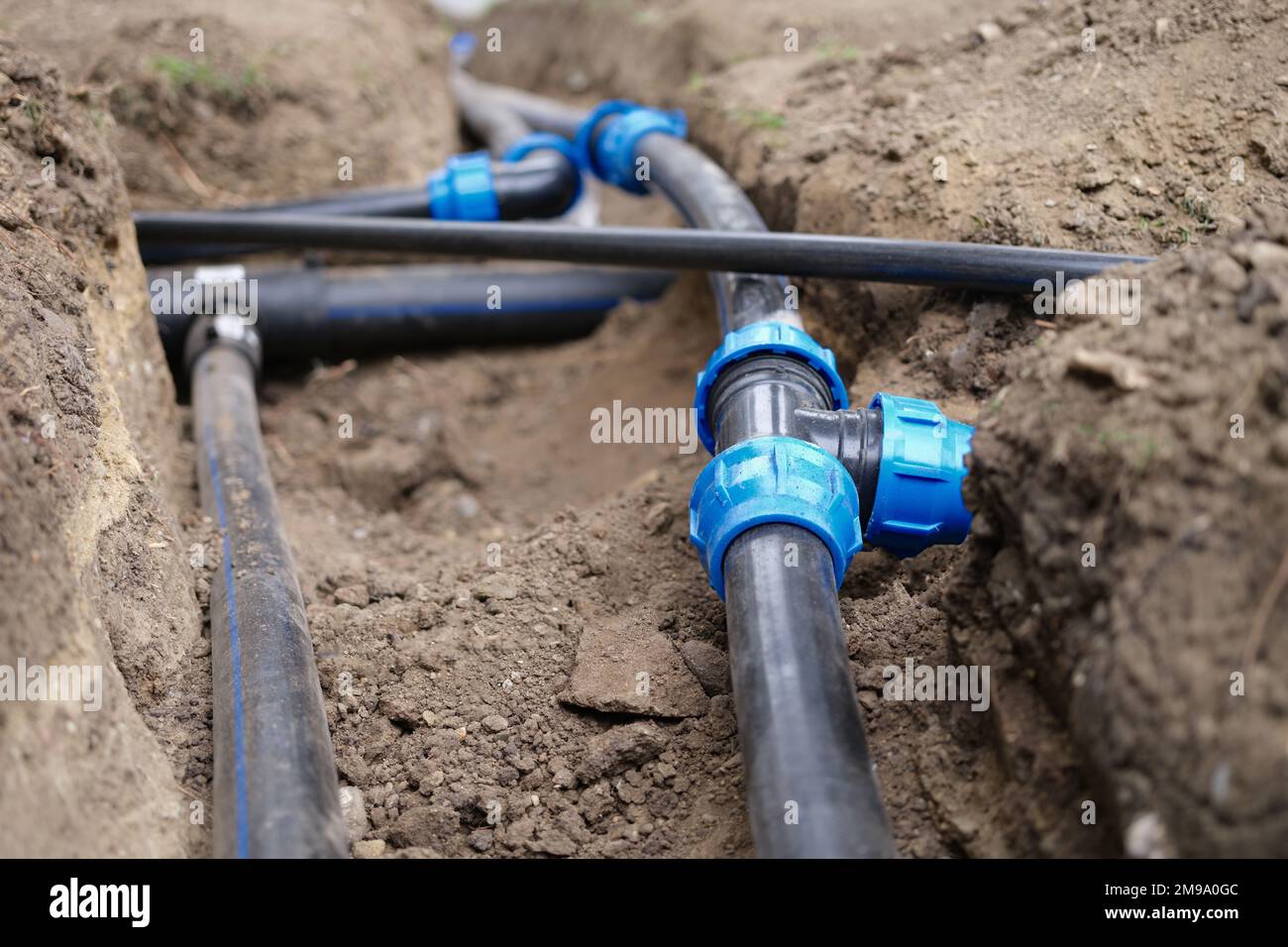 Installation of pipeline irrigation system outdoor Stock Photo - Alamy