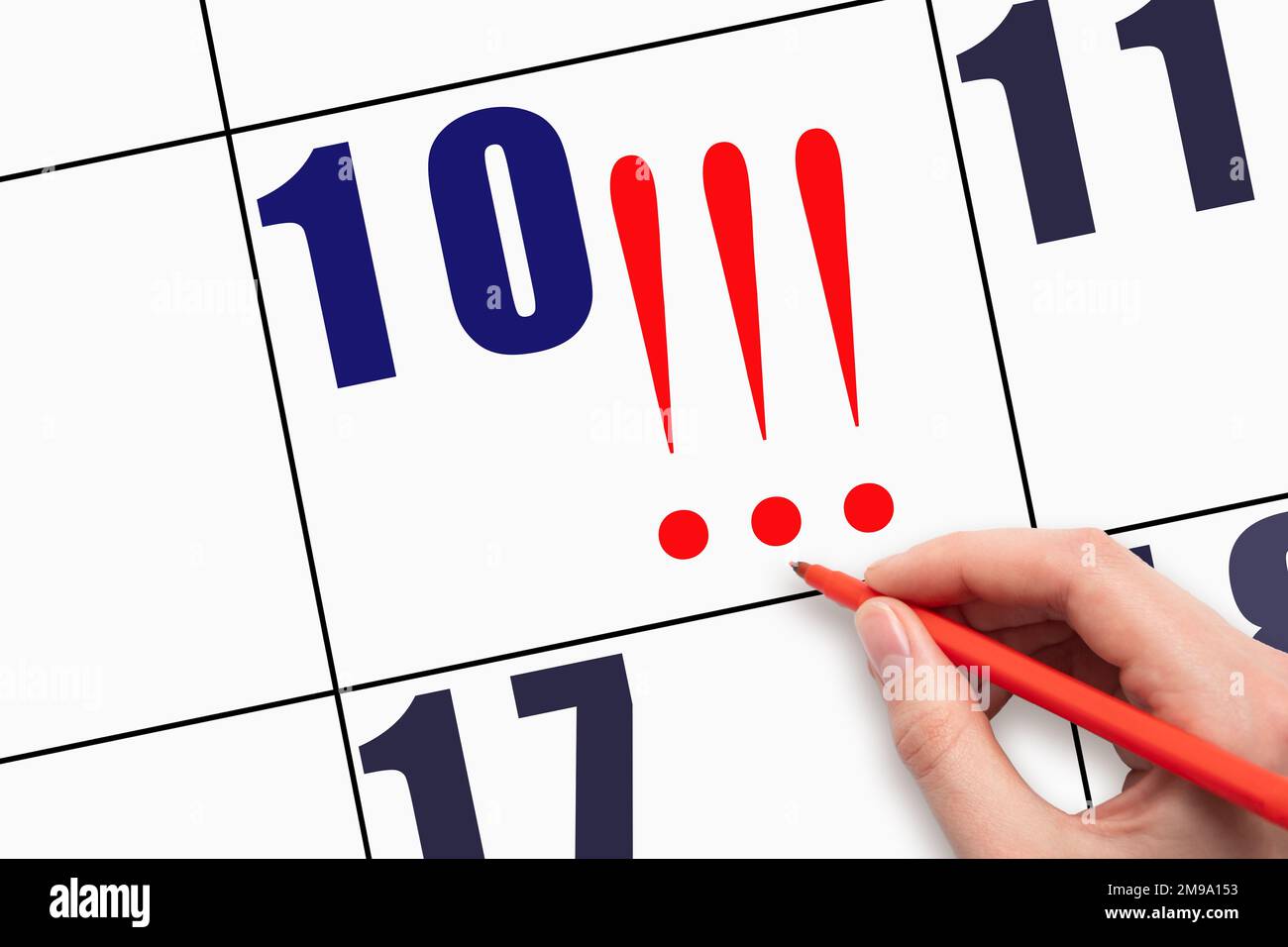 10th day of the month. Hand writing three exclamation marks on calendar ...