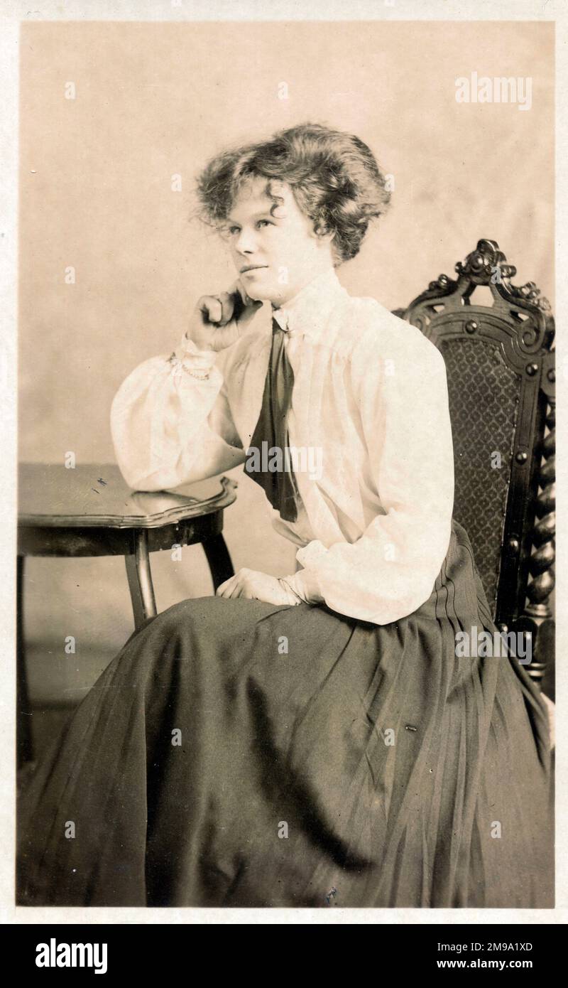 Seated woman in skirt hi-res stock photography and images - Alamy