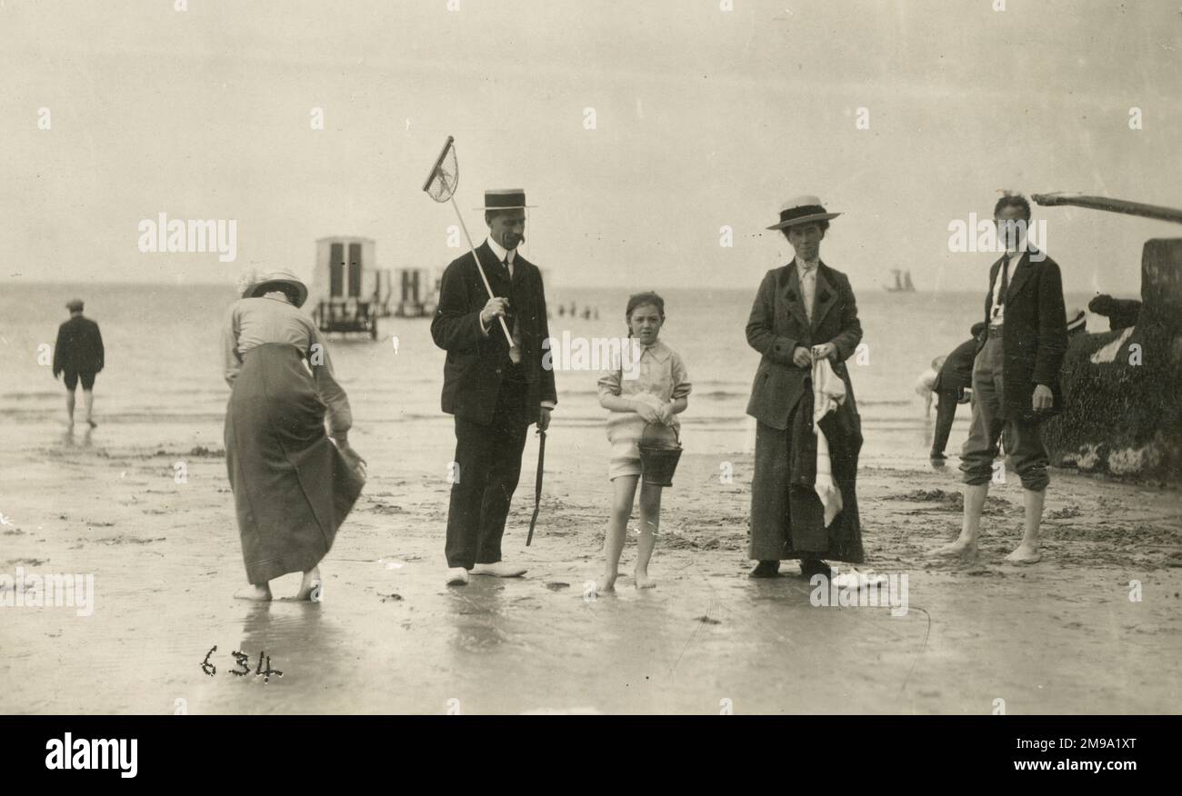 Family Group posing for a photograph on the sandy beach at Margate ...