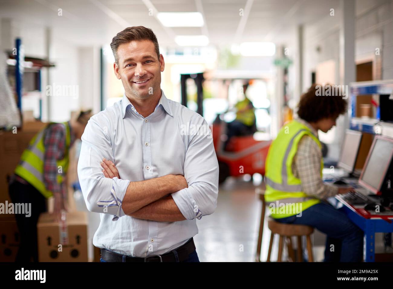 Portrait Of Male Manager In Logistics Distribution Warehouse Stock ...