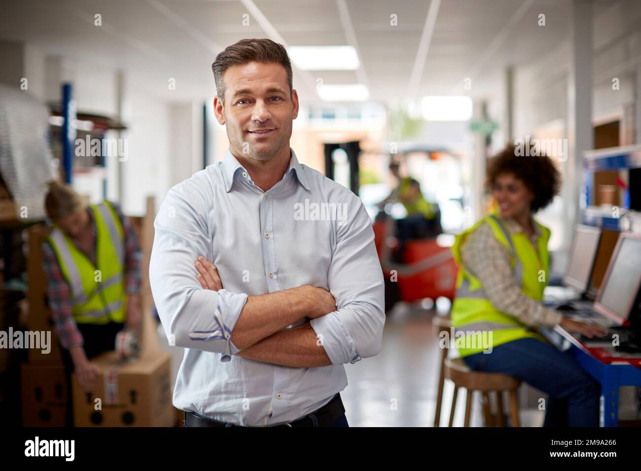 Portrait Of Male Manager In Logistics Distribution Warehouse Stock ...