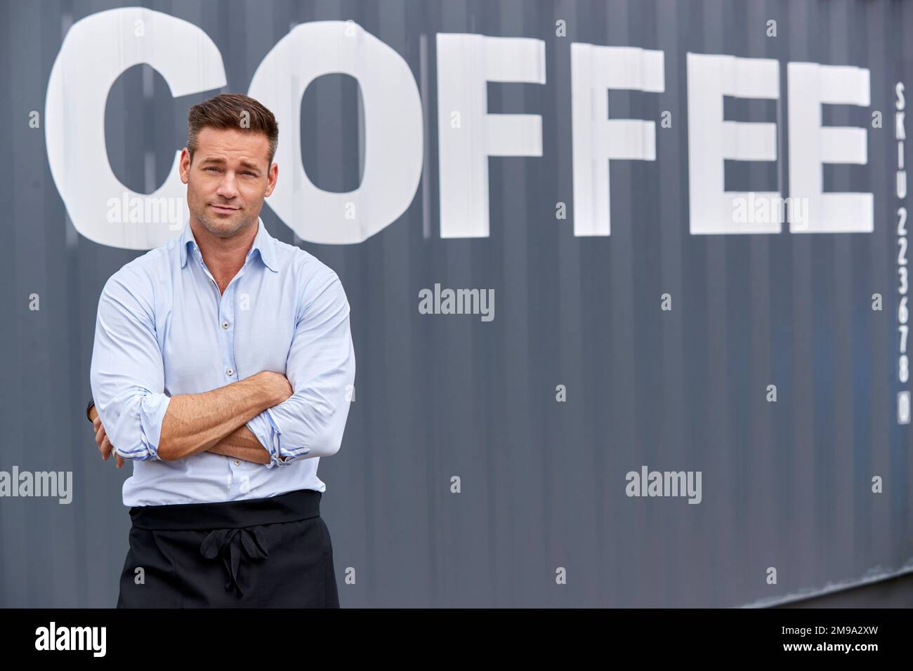 Portrait Of Male Owner Of Coffee Shop Or Distribution Business Standing ...