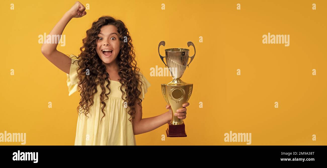 happiness. happy amazed teen girl hold golden cup. achievement award ...