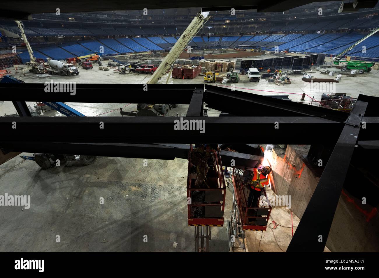 A worker welds a steel beam during the Rogers Centre renovation in ...