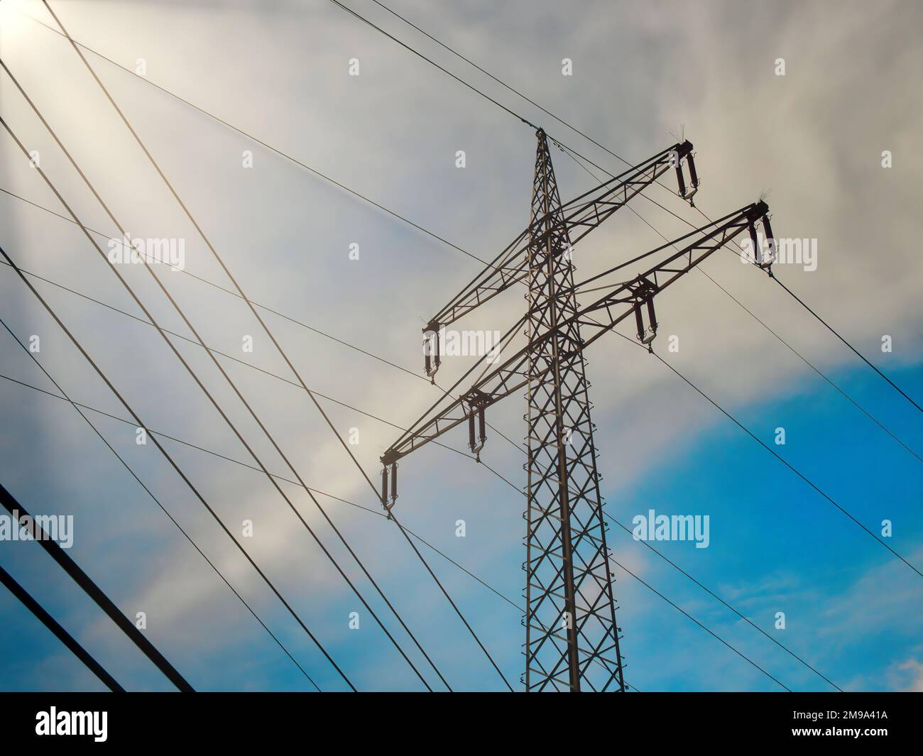 A high voltage pylon with many cables isolated Stock Photo - Alamy