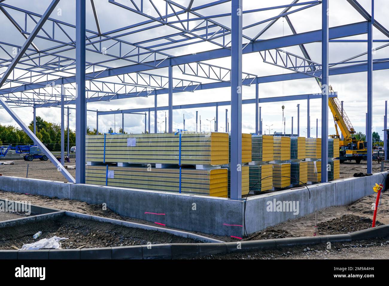 Steel structure framework building and stacks of sandwich panels for ...