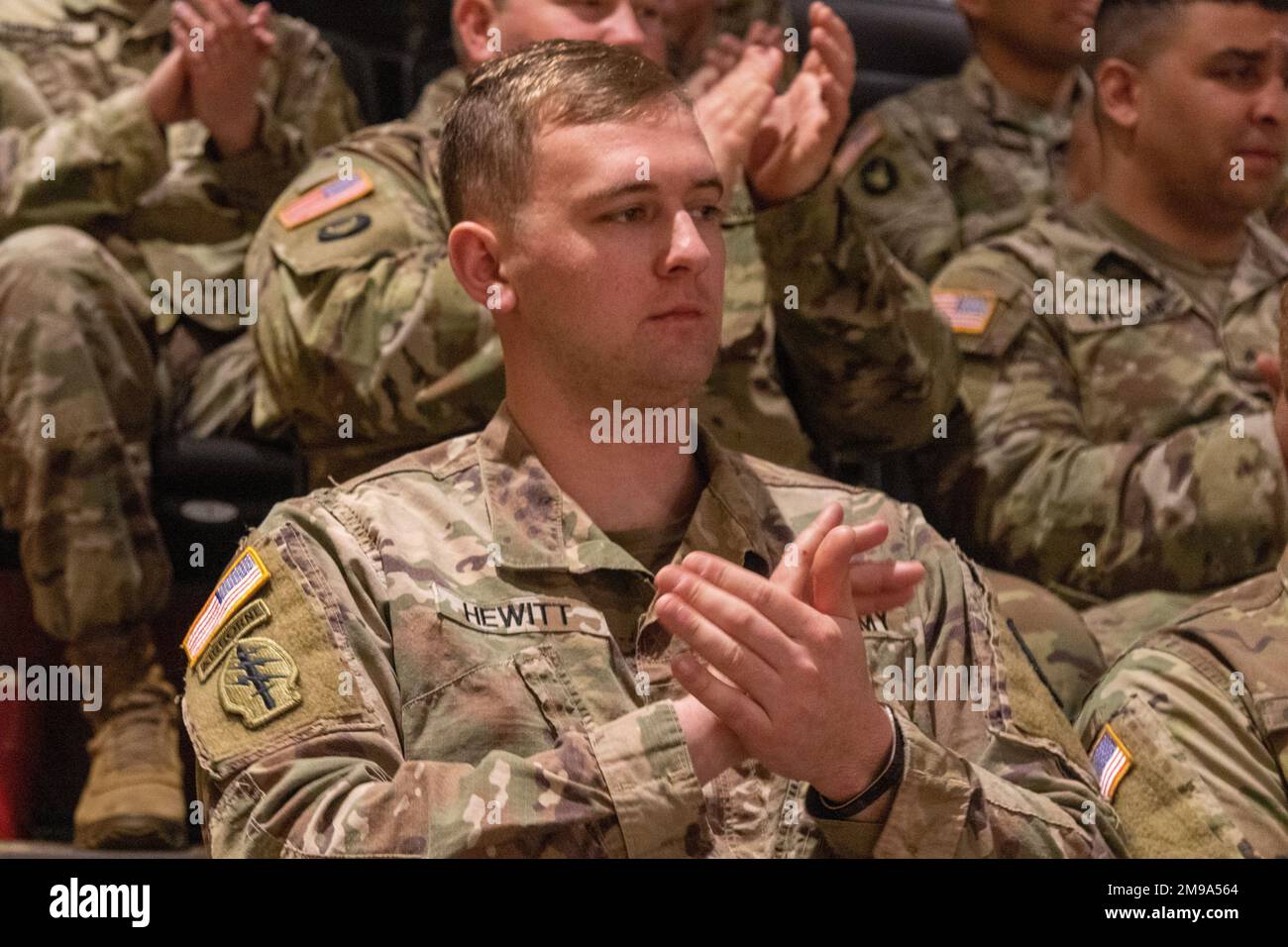 Spc. Jordan Hewitt, of the 850th Engineer Company applaud as the ...