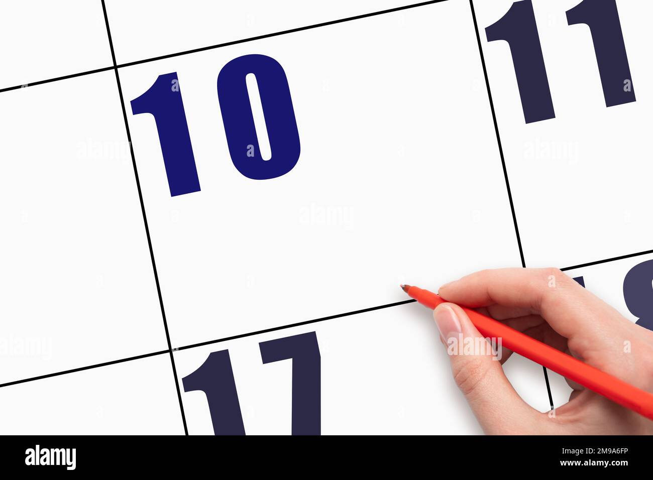 10th day of the month. Hand holding the red pen points to an empty ...