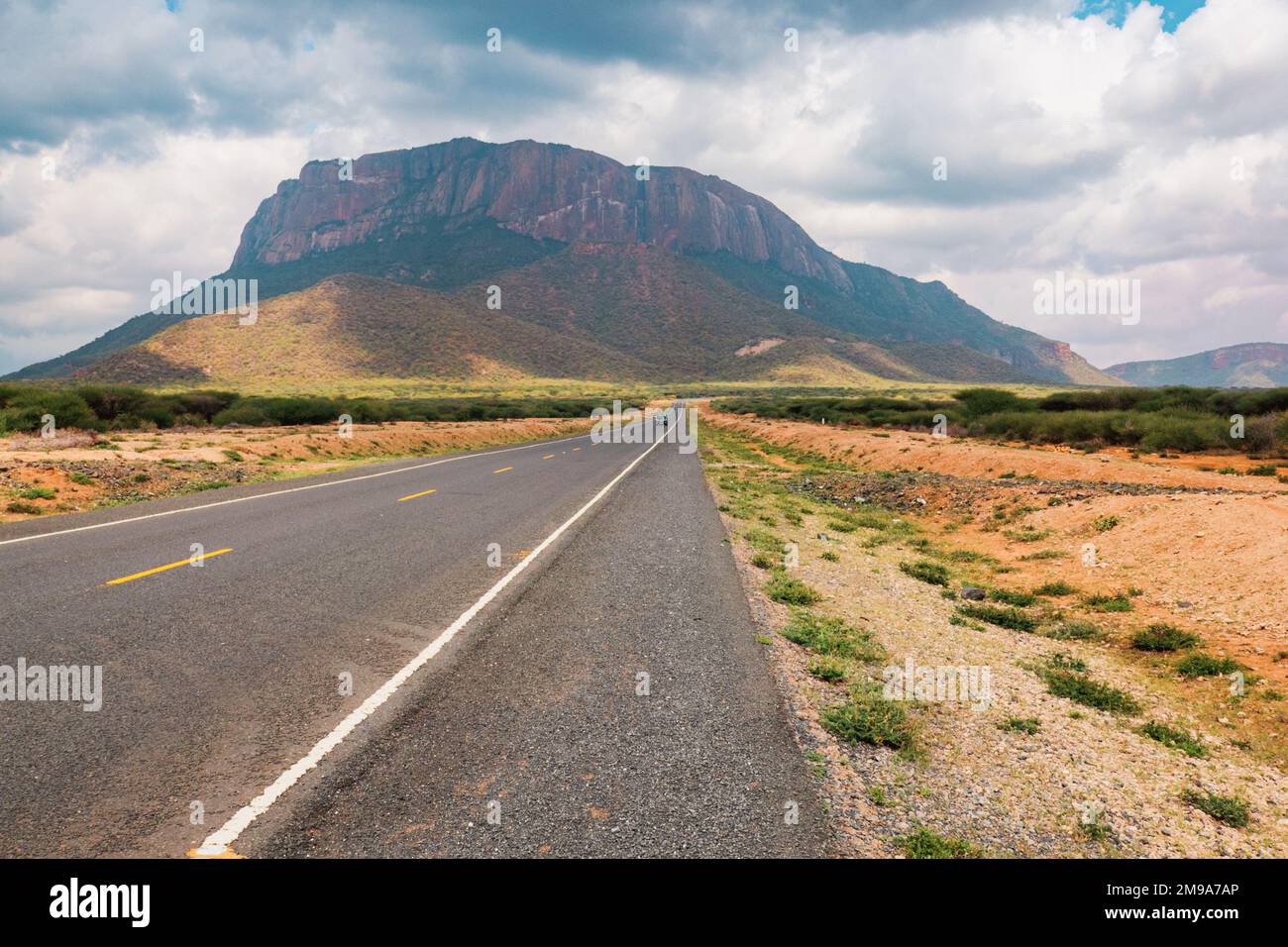 Scenic view of an empty highway against the background of Mount ...
