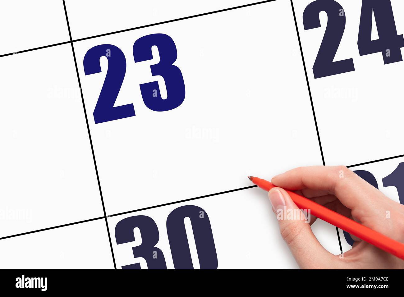 23rd day of the month. Hand holding the red pen points to an empty ...