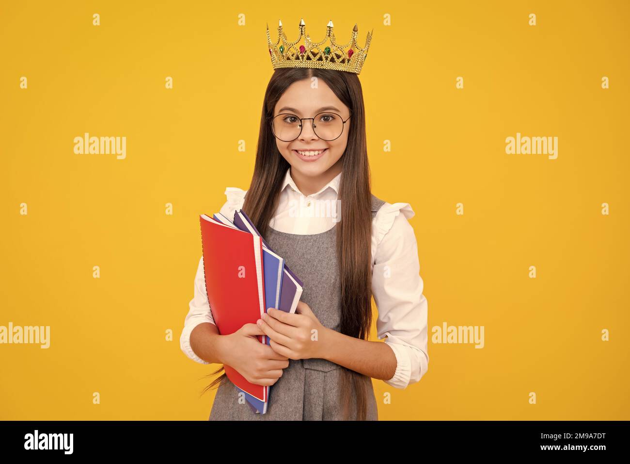 Schoolgirl nerd princess in school uniform and crown celebrating ...