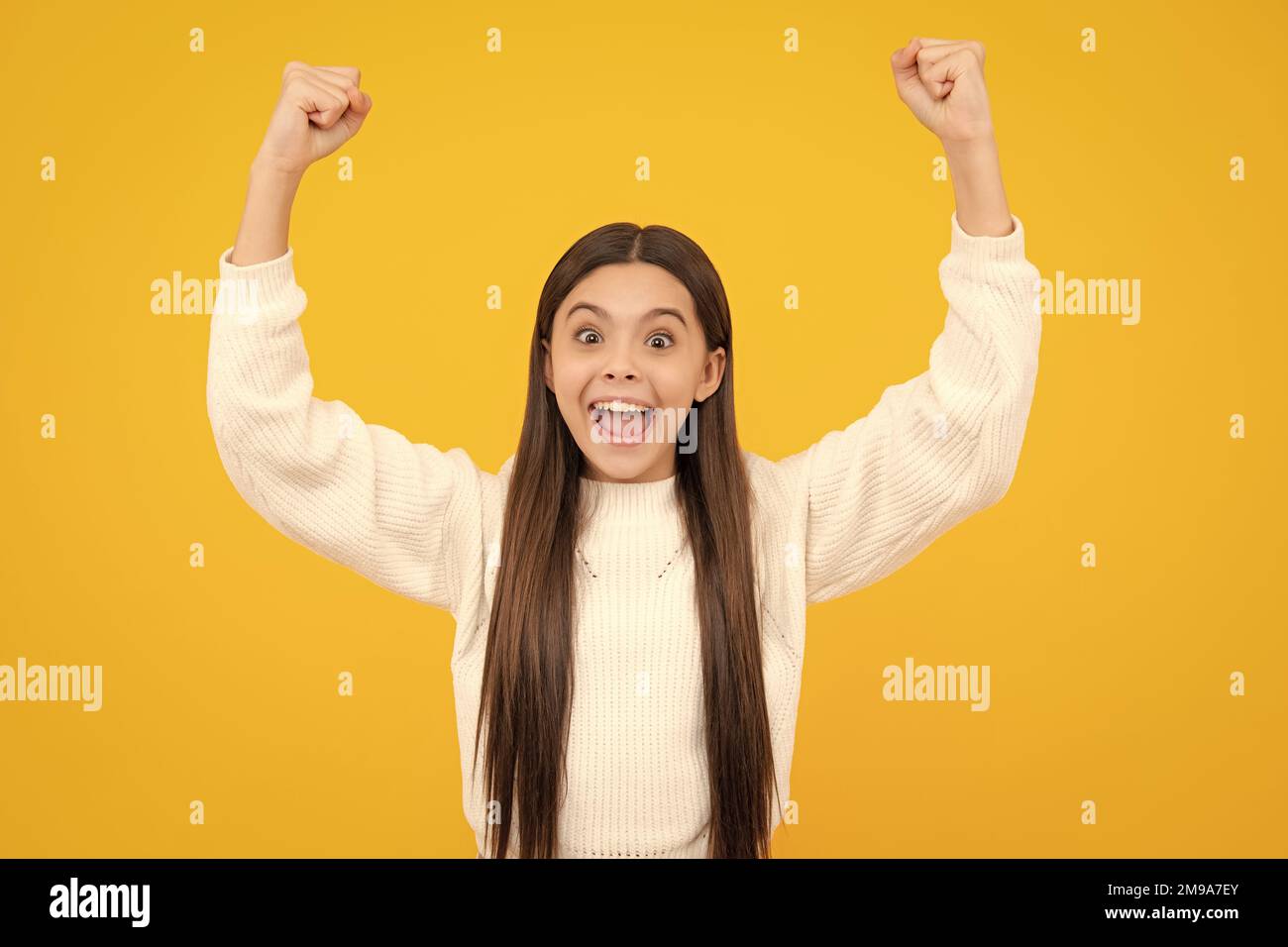 Child girl rejoicing, say yes, looking happy and celebrating victory ...