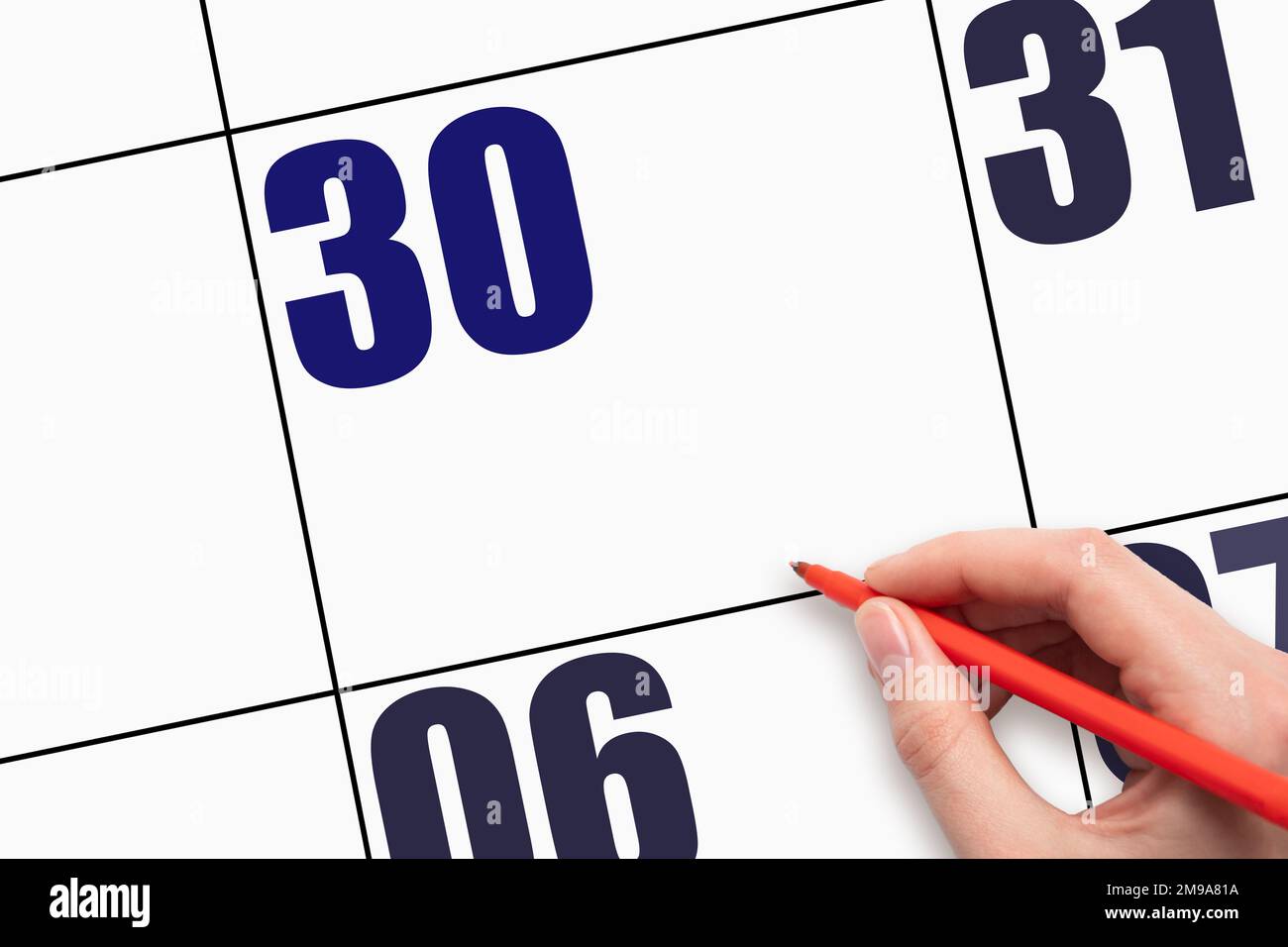 30th day of the month. Hand holding the red pen points to an empty ...
