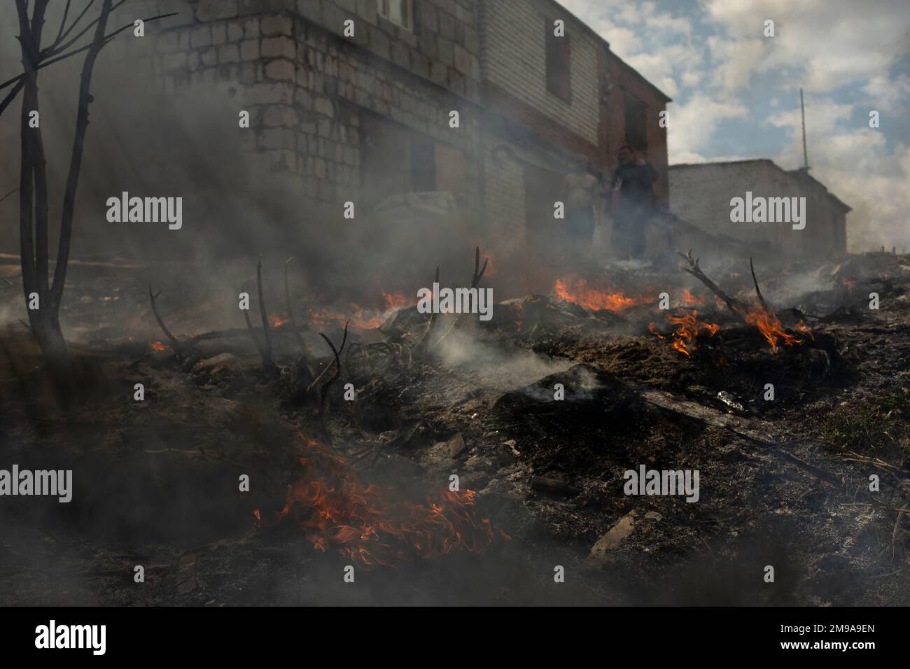 Black smoke from fire. Burning of garbage. Destruction of nature ...