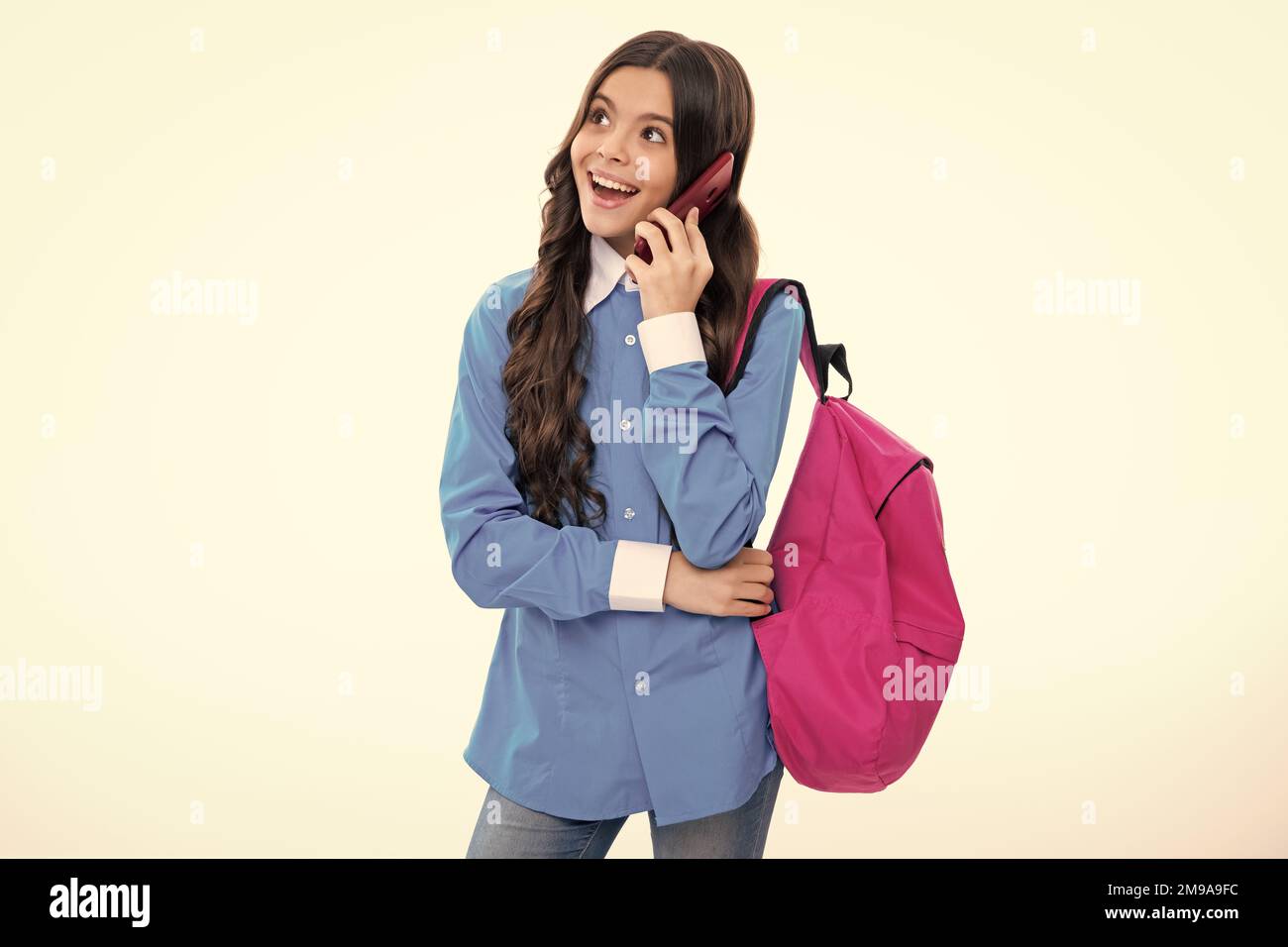Teen school student girl hold backpack use mobile cell phone on white ...