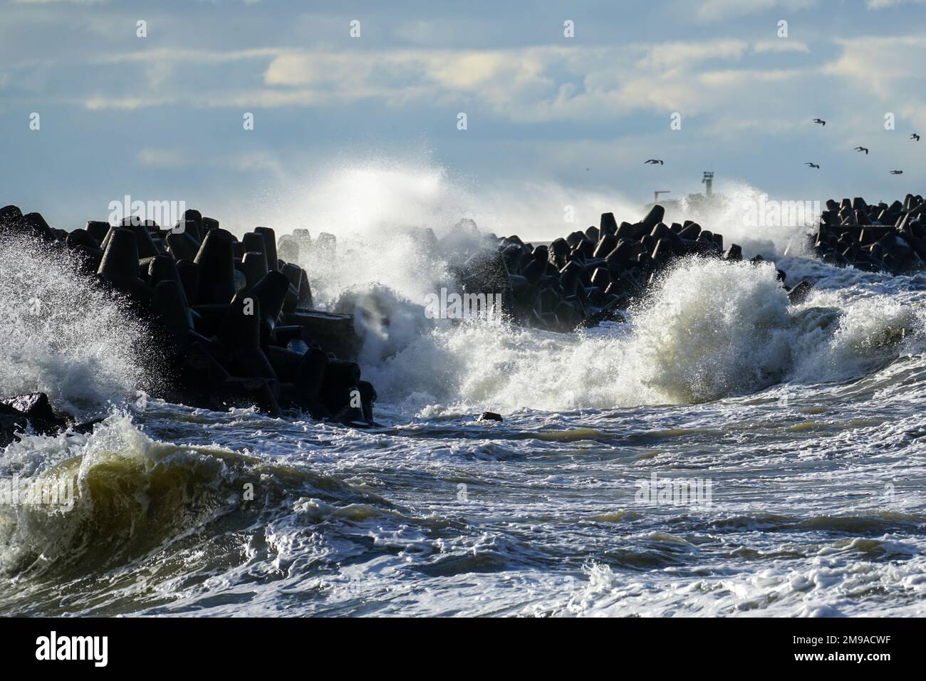 Coastal storm in the Baltic Sea, big waves crash against the concrete ...