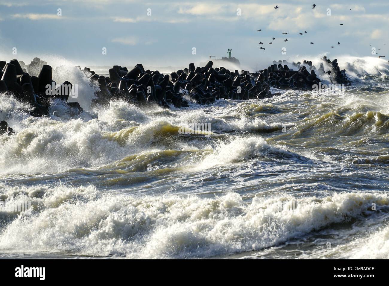Coastal storm in the Baltic Sea, big waves crash against the concrete ...