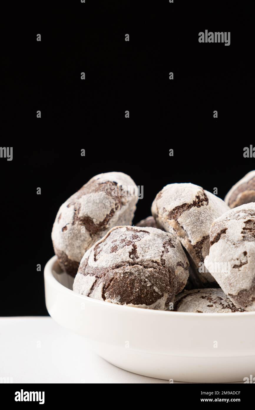 Chocolate chip cookies with cocoa and powdered sugar on a plate on a ...