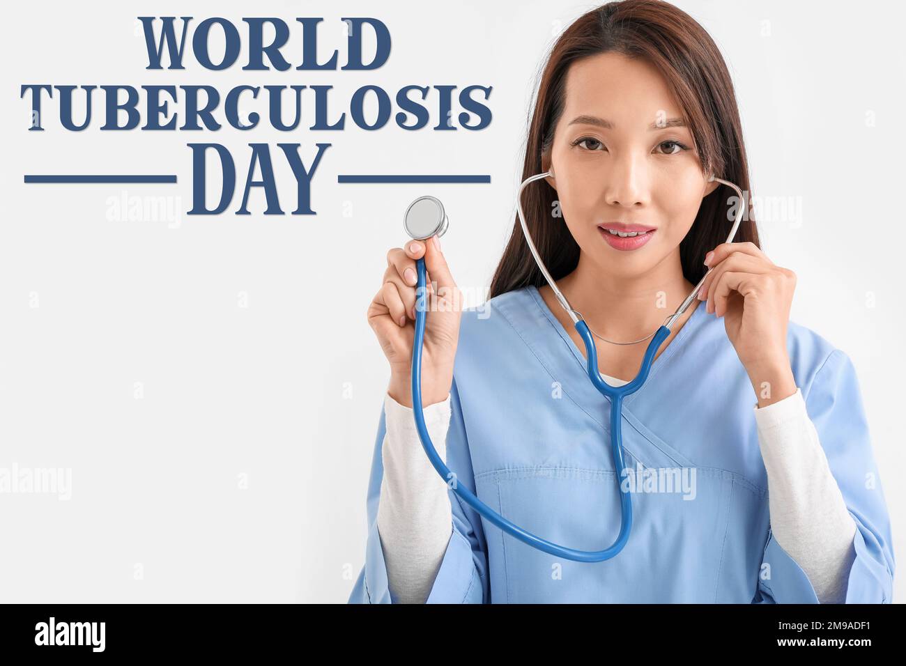 Asian doctor with stethoscope and text WORLD TUBERCULOSIS DAY on light ...