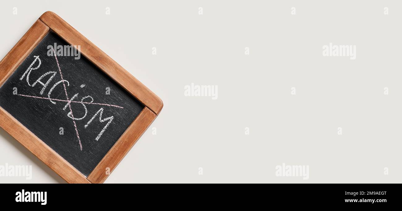 Chalkboard with crossed out word RACISM on white background with space ...