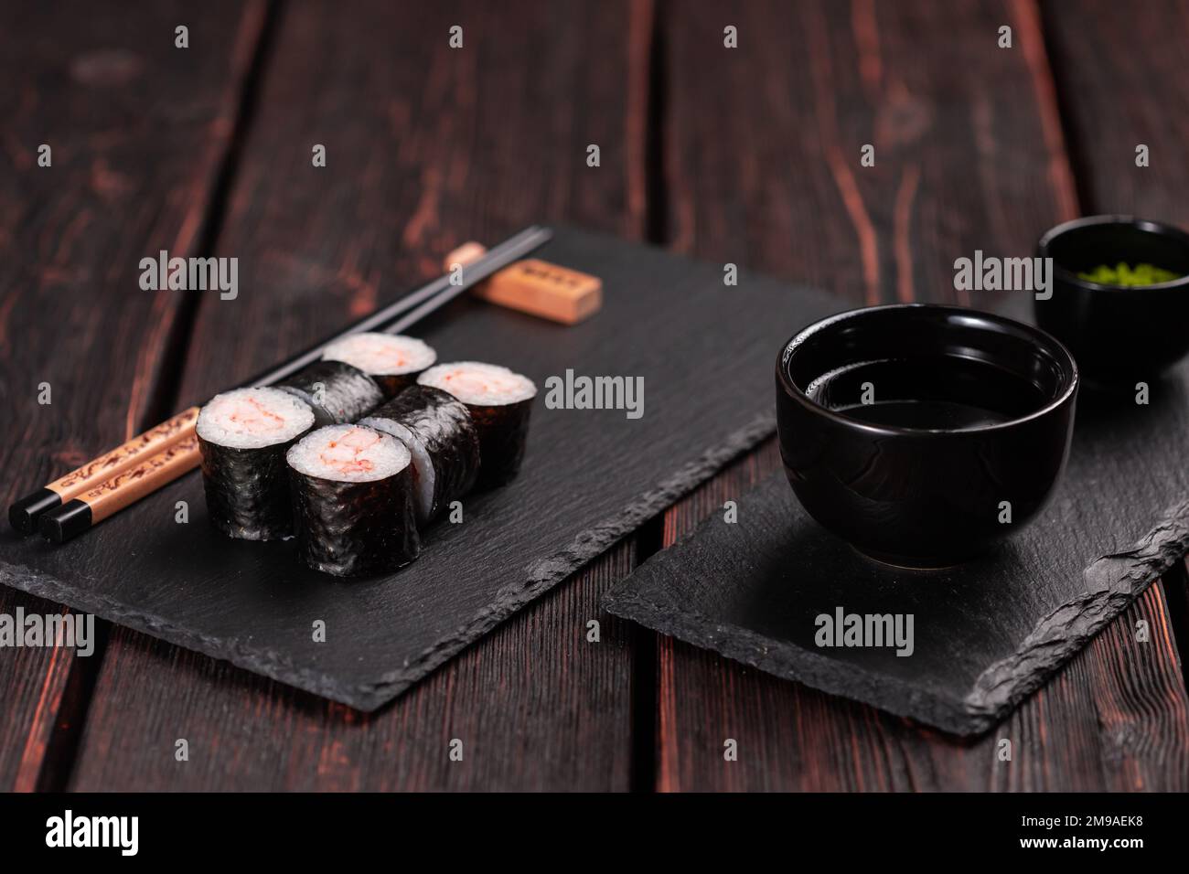 Maki shrimp sushi close-up. Shrimp fillet stuffing wrapped in rice and ...