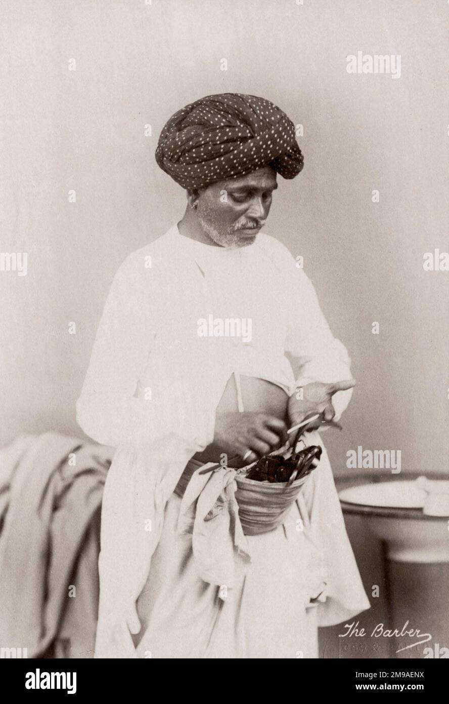 c.1880s India - Indian servant - man sewing Stock Photo - Alamy