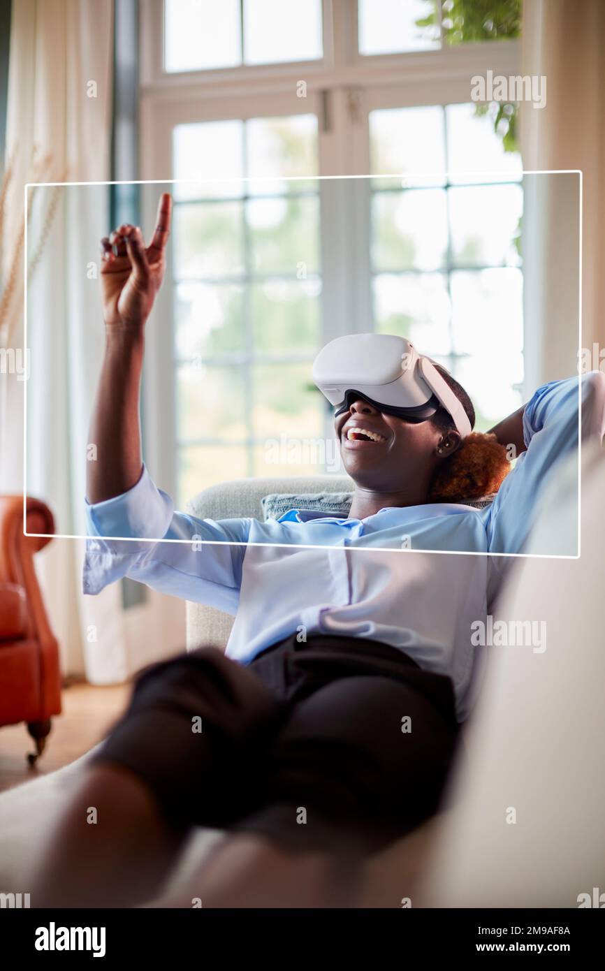Woman Relaxing Lying On Sofa At Home Wearing VR Headset And Interacting ...