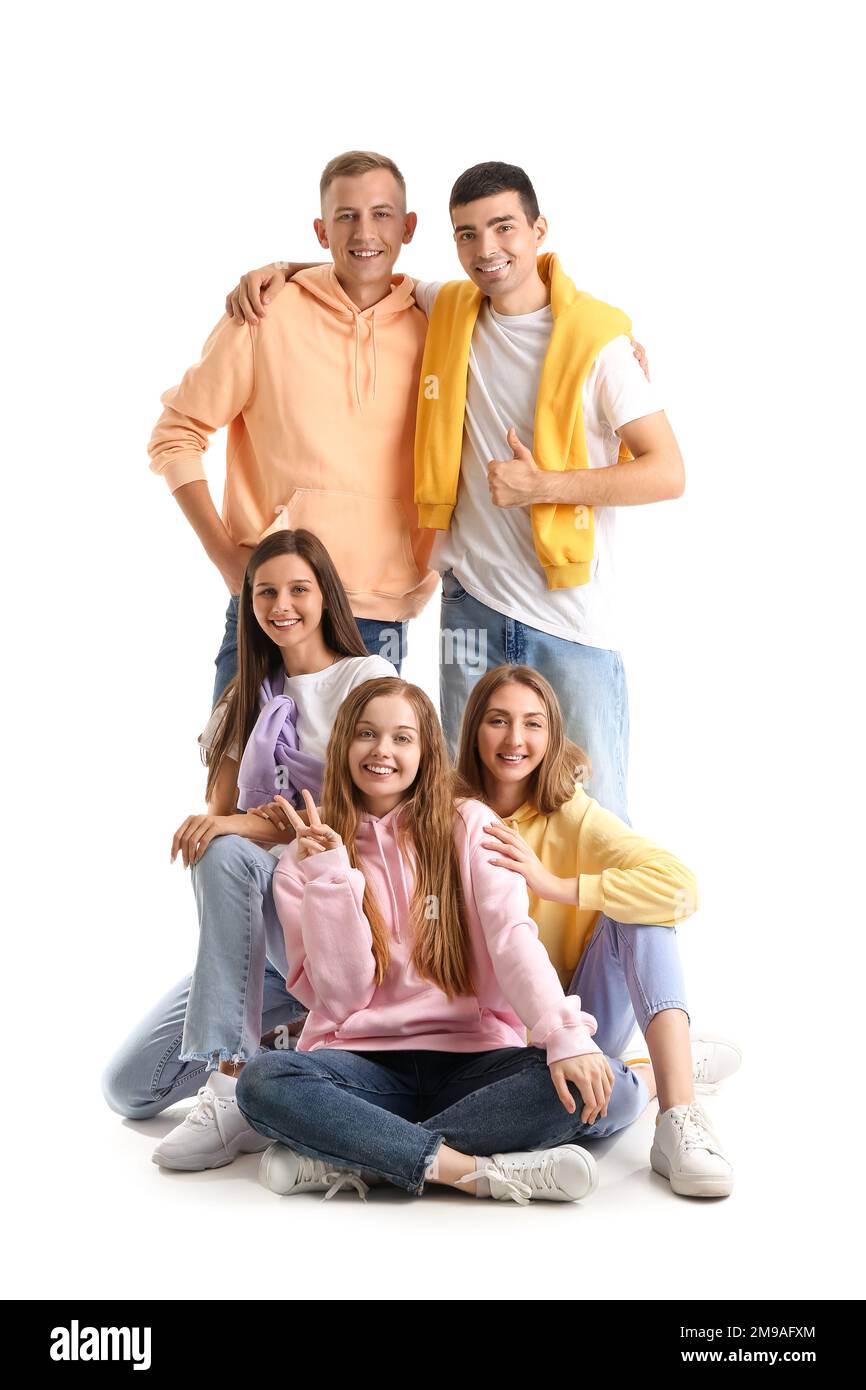Group of happy friends gesturing on white background Stock Photo - Alamy