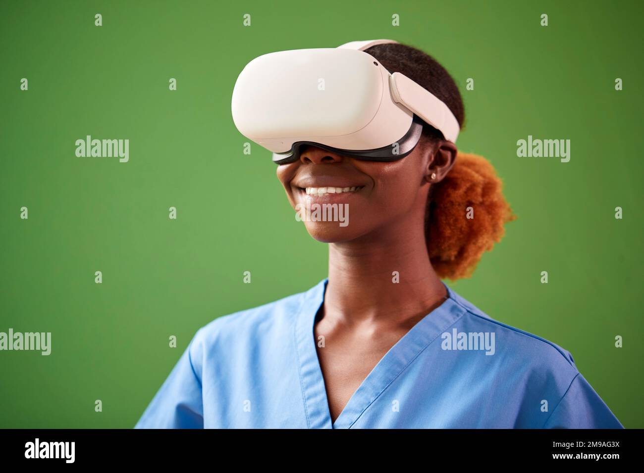 Female Nurse Or Doctor In Scrubs With VR Headset Interacting With AR ...
