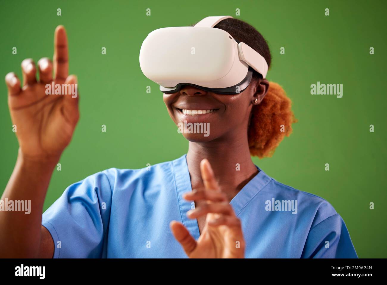 Female Nurse Or Doctor In Scrubs With VR Headset Interacting With AR ...