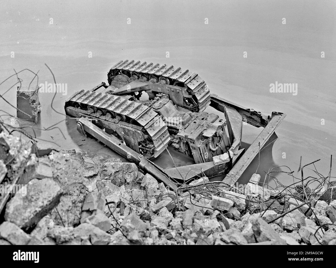 A Striken Caterpillar Tractor which has taken a tumble down the steep ...