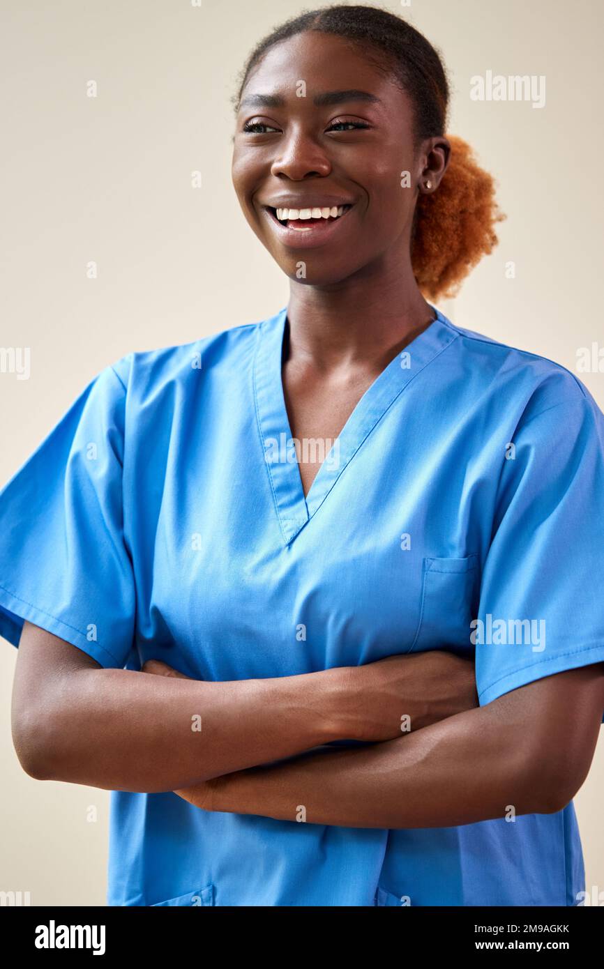 Portrait Of Laughing Female Nurse Or Doctor Wearing Scrubs Stock Photo ...