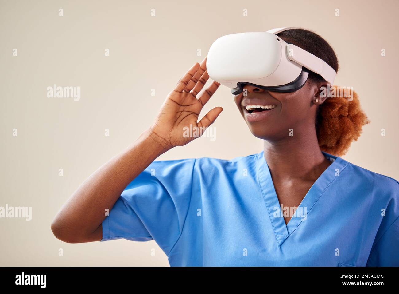 Female Nurse Or Doctor In Scrubs With VR Headset Interacting With AR ...