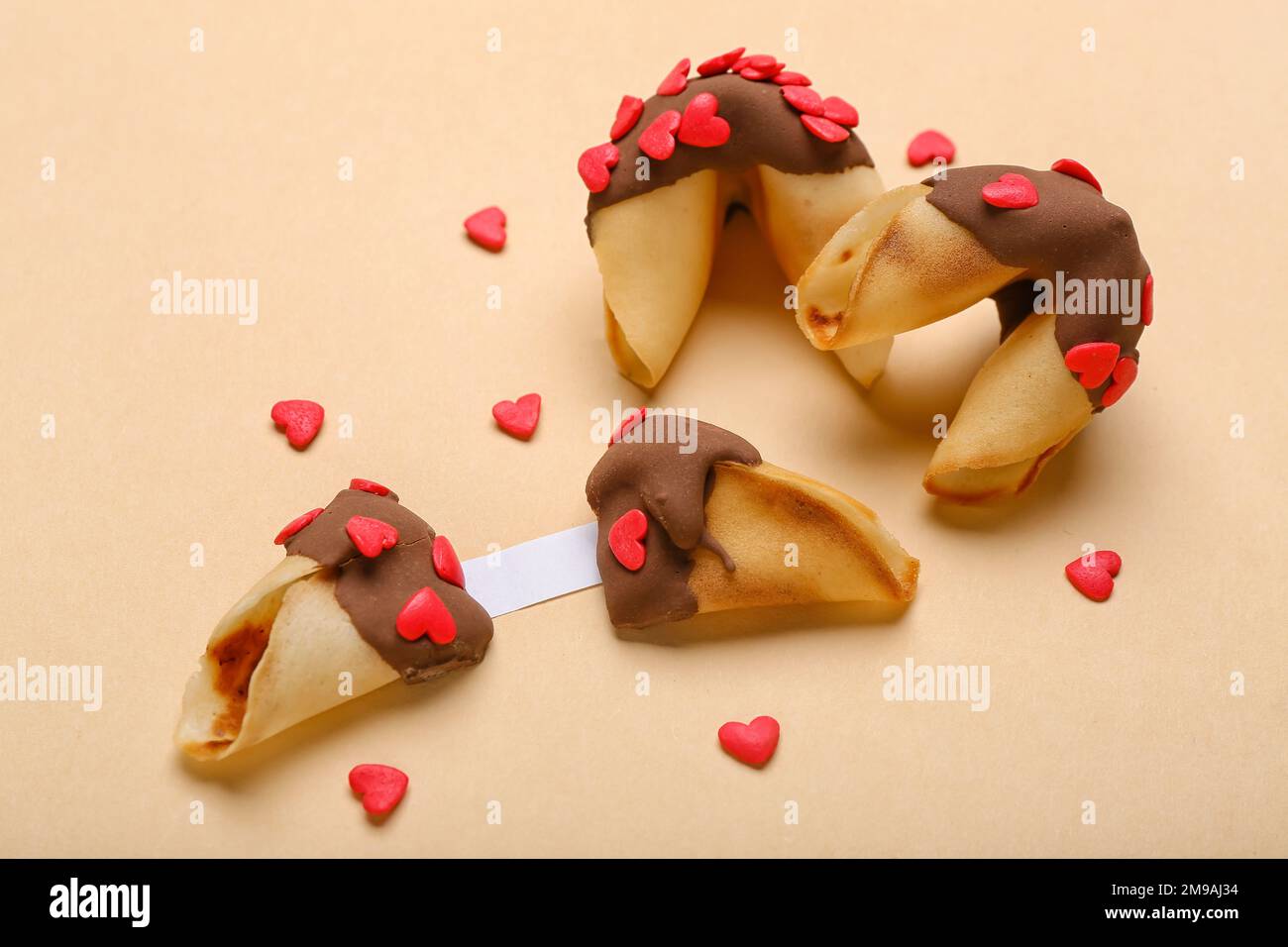 Fortune cookies with hearts on beige background. Valentine's Day ...