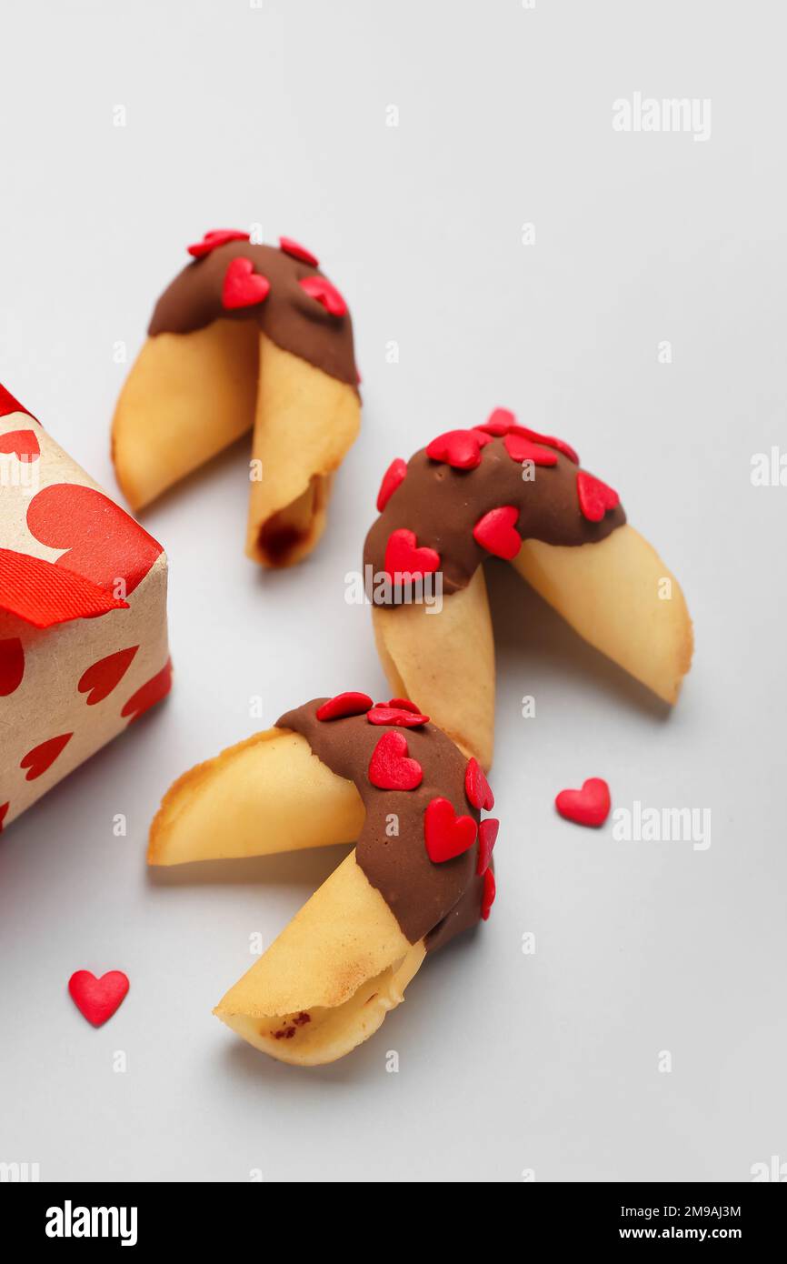 Fortune cookies with gift on grey background, closeup. Valentine's Day ...