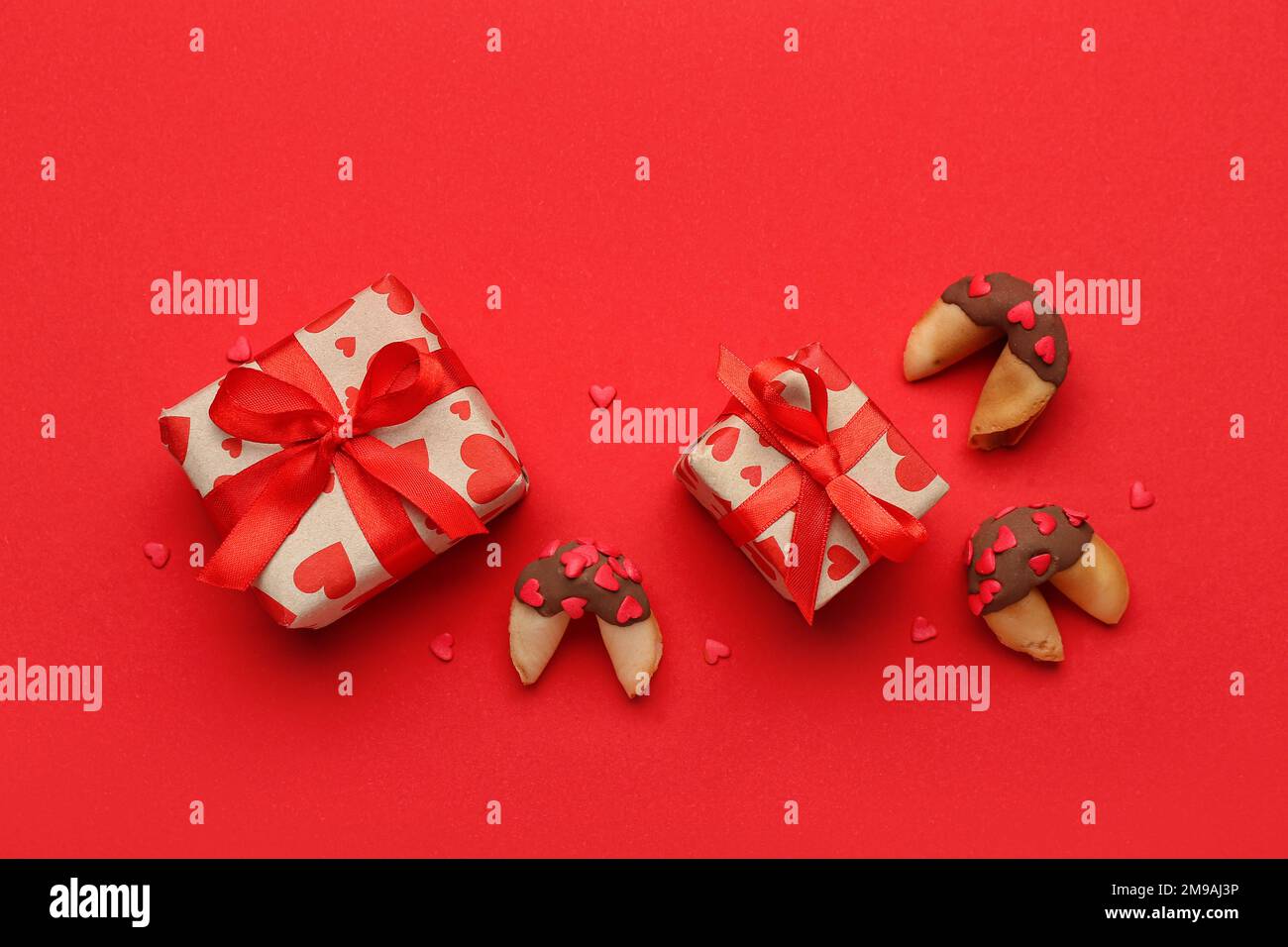 Fortune cookies with gifts on red background. Valentine's Day ...
