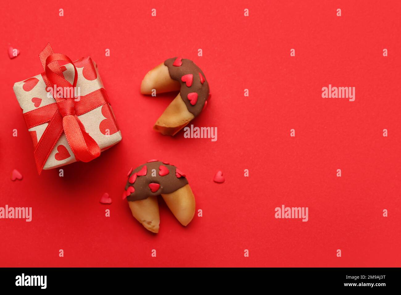 Fortune cookies with gift on red background. Valentine's Day ...