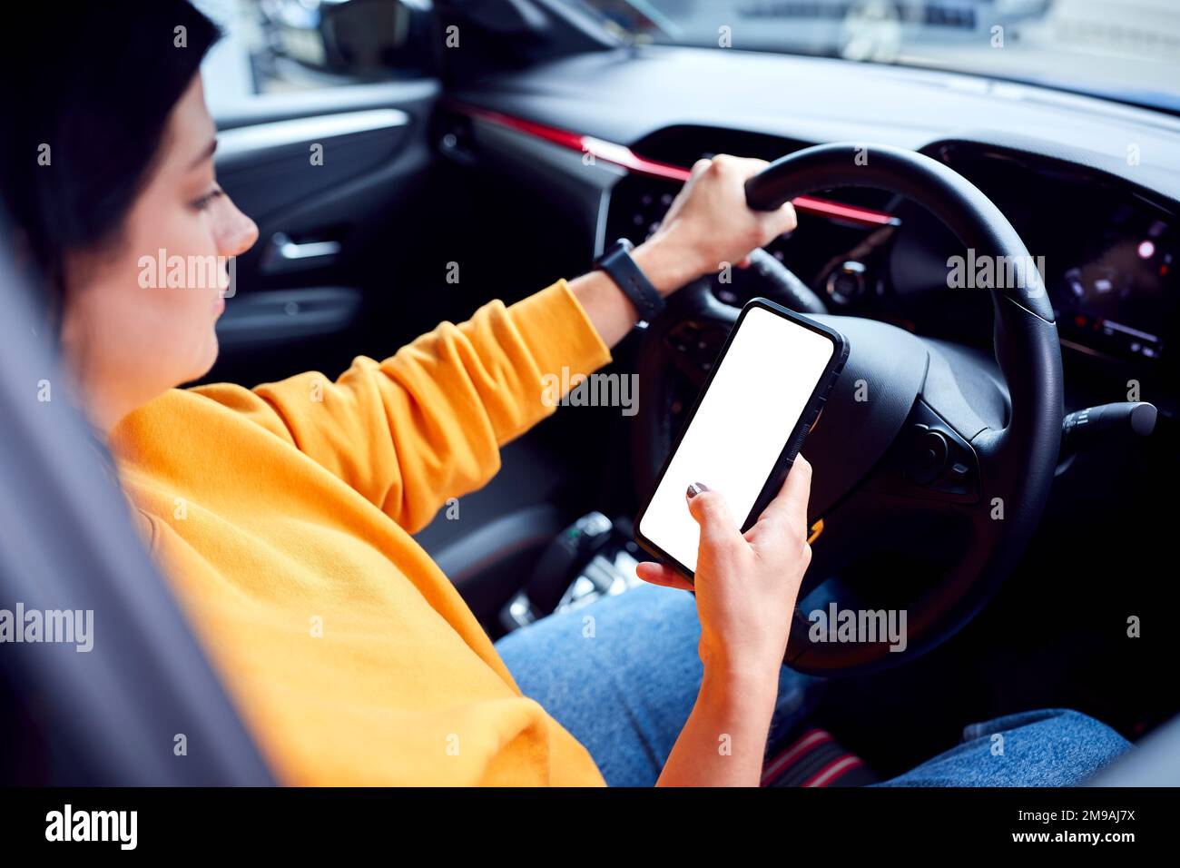 Woman texting driving hi-res stock photography and images - Alamy